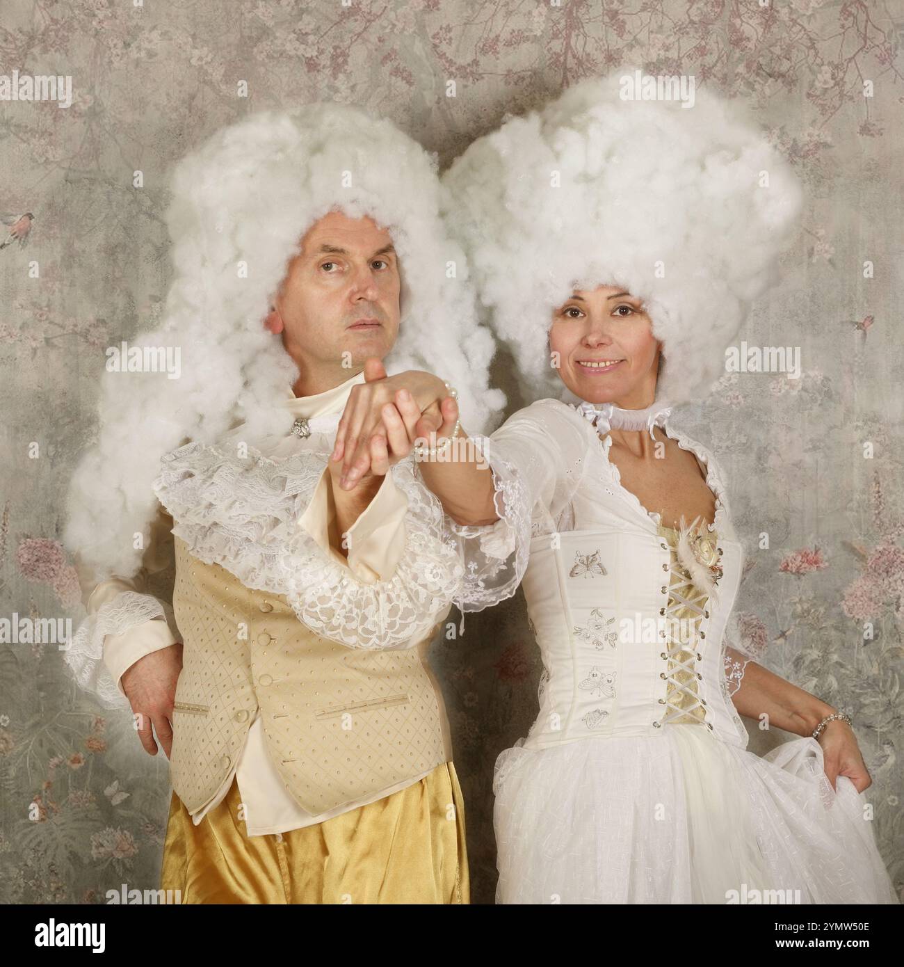 Cute couple in Baroque style clothes dancing in the studio Stock Photo ...