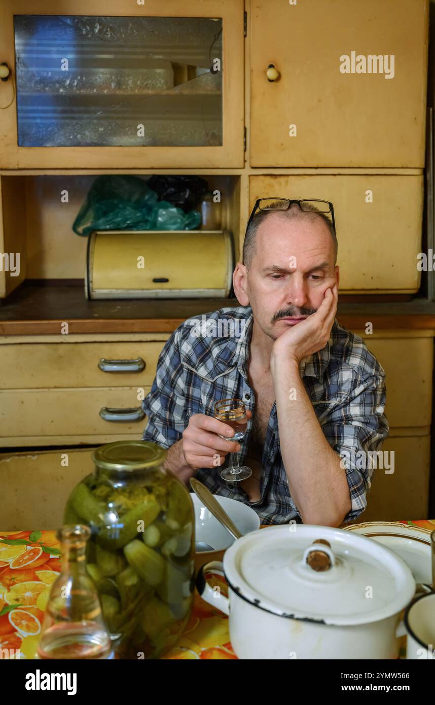 Drunk man sitting in hi-res stock photography and images - Alamy