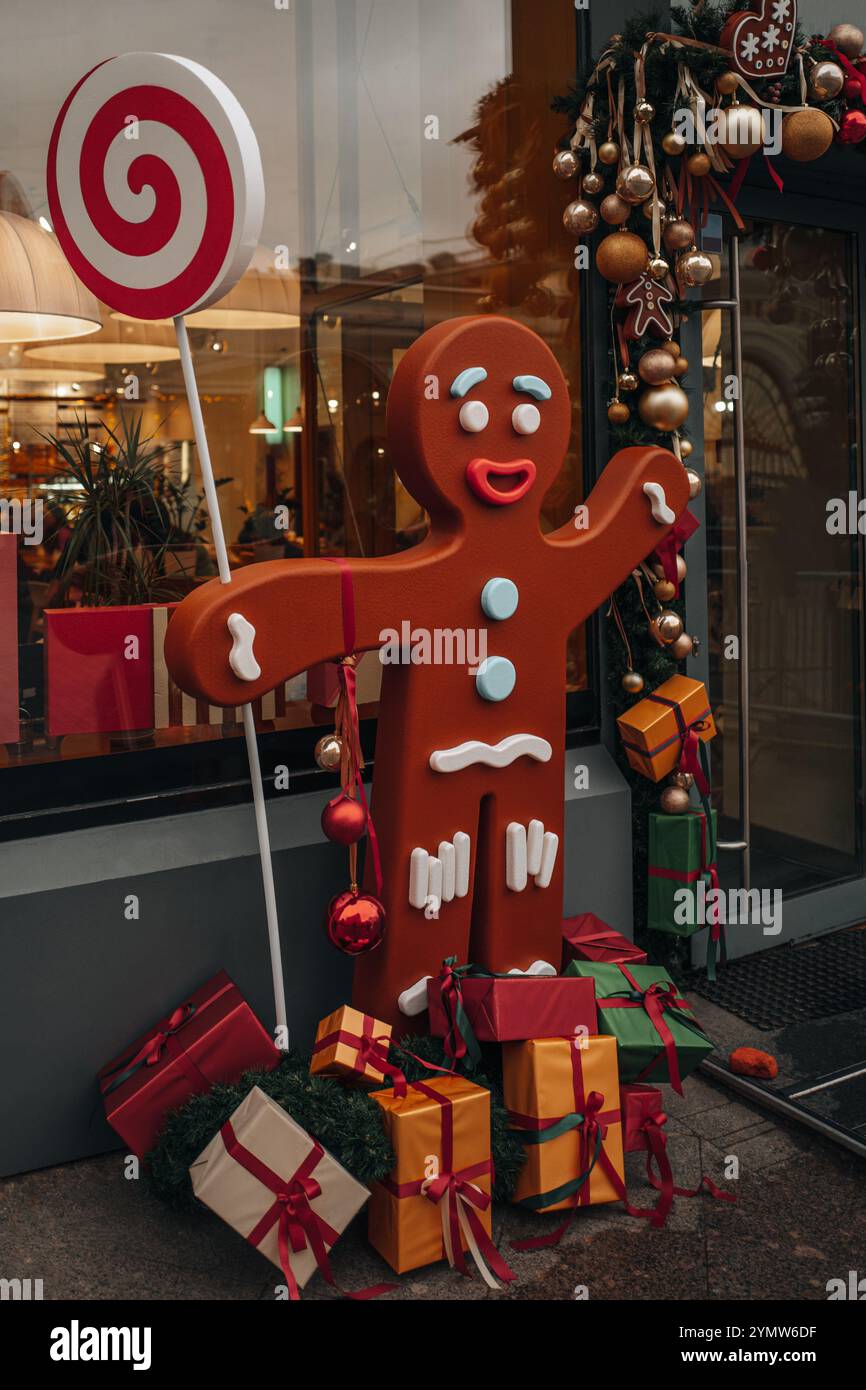 Cute outdoor Christmas decor of funny cartoon gingerbread man with ...