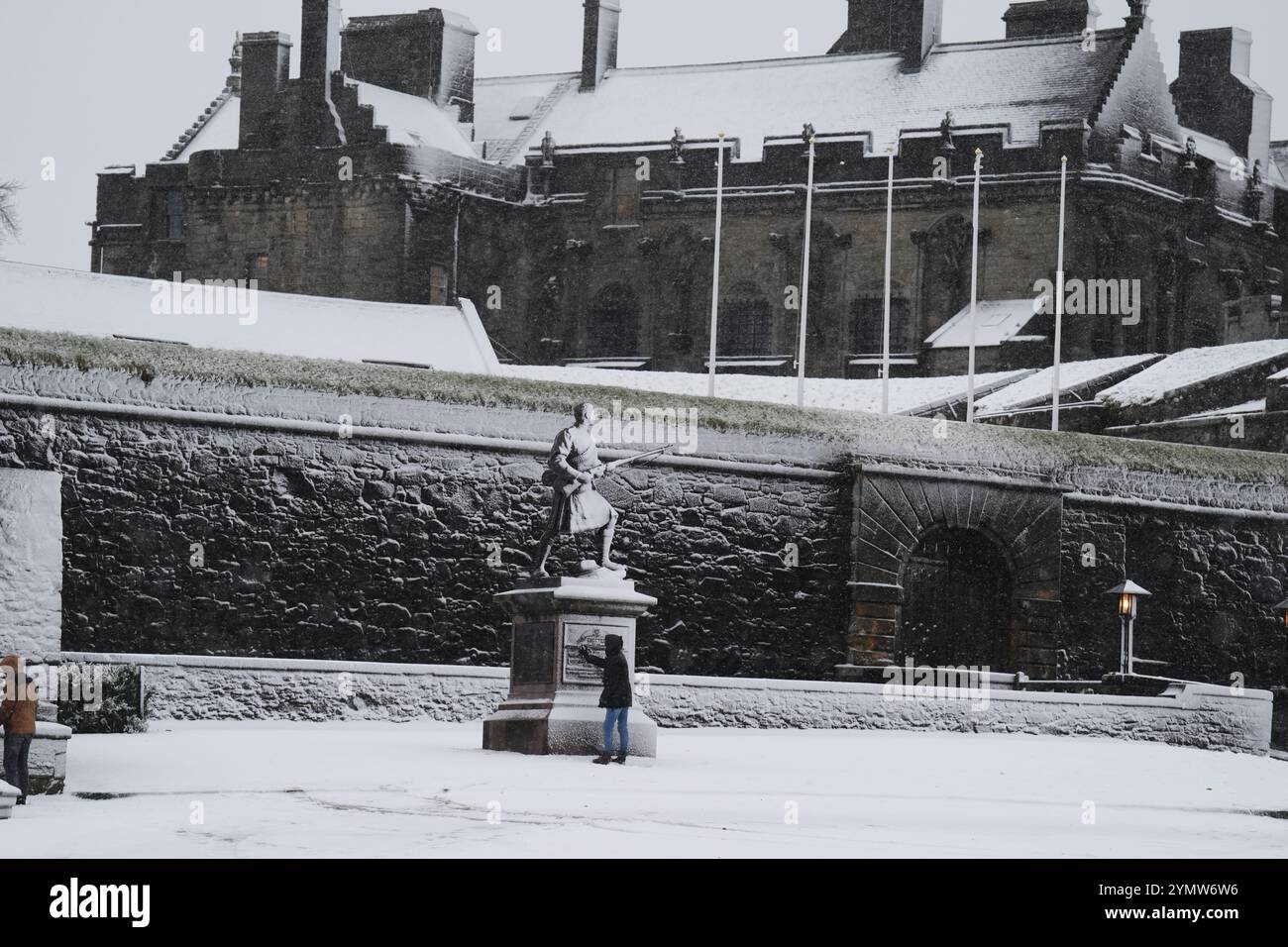 People walk in the snow at Stirling Castle, Stirling, Scotland. Storm ...