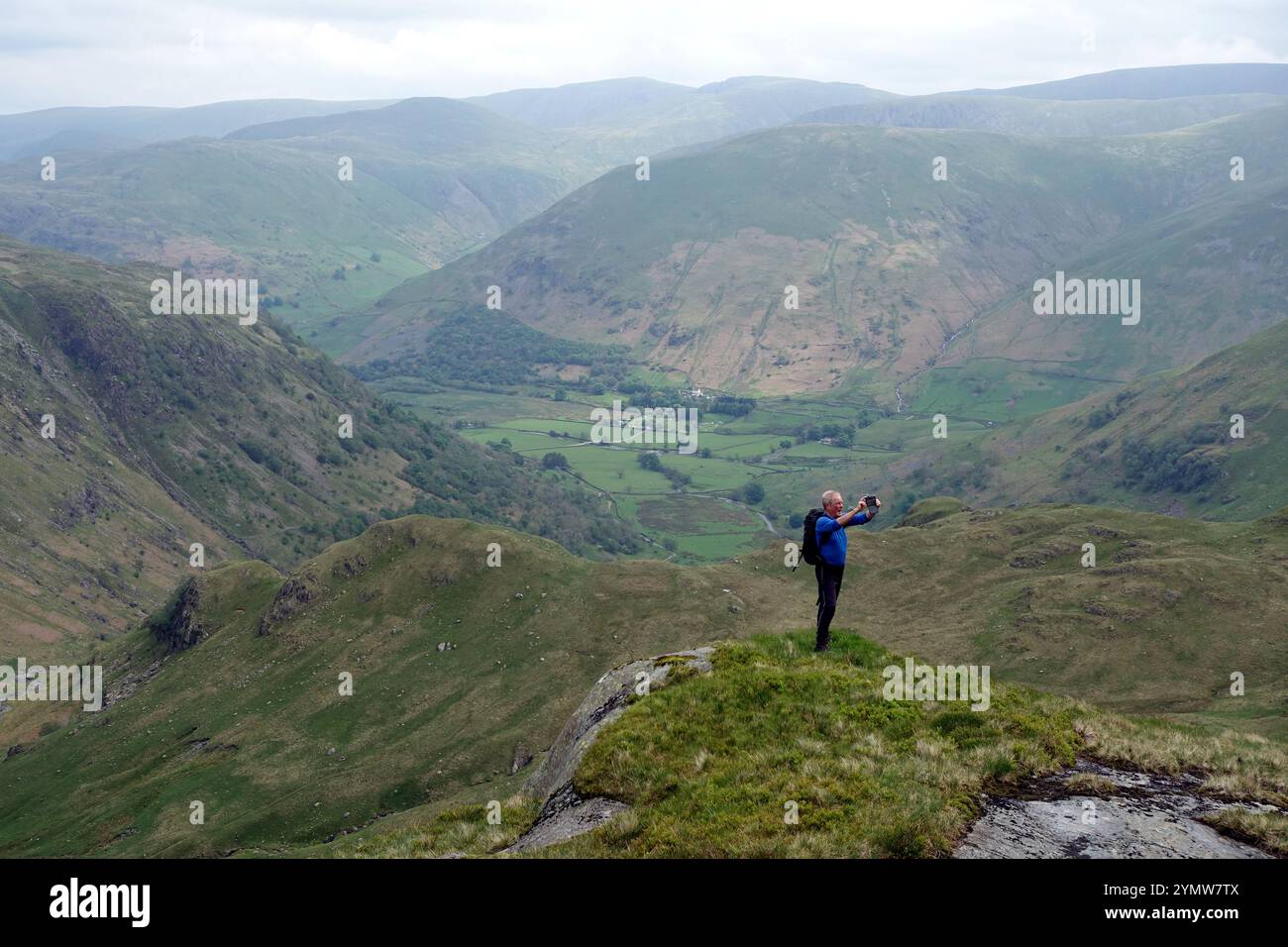 Man (Hiker) above the Dovedale Valley Taking Photo the Wainwright 'Dove ...