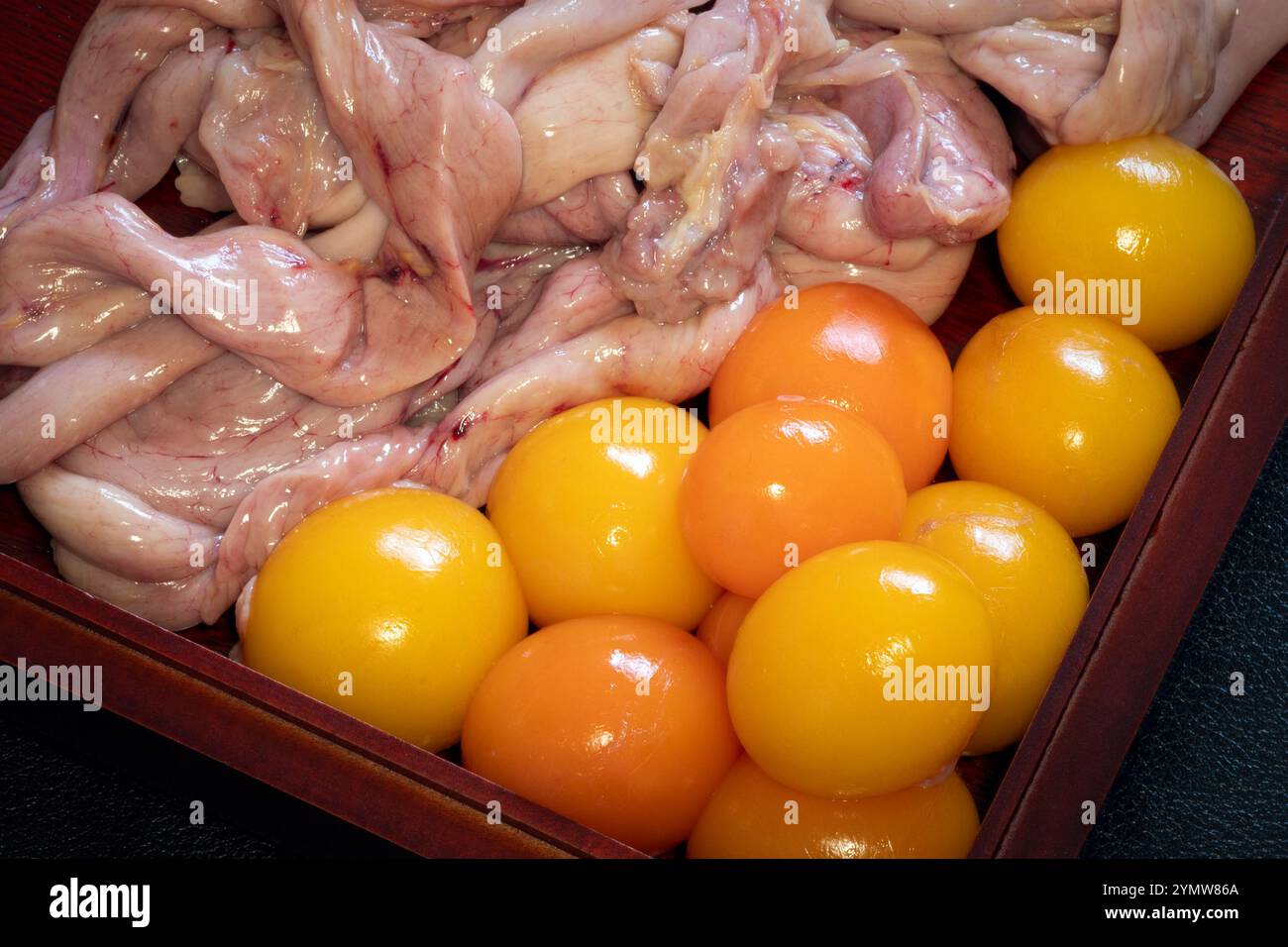 Fresh unlaid chicken eggs with chicken intestines and organs Stock ...