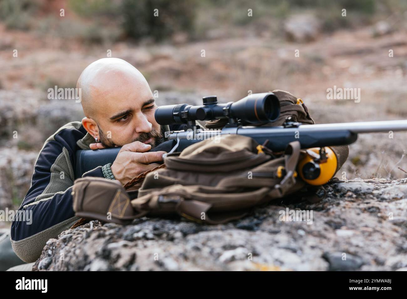 Hunter aiming with rifle in nature during hunt Stock Photo - Alamy