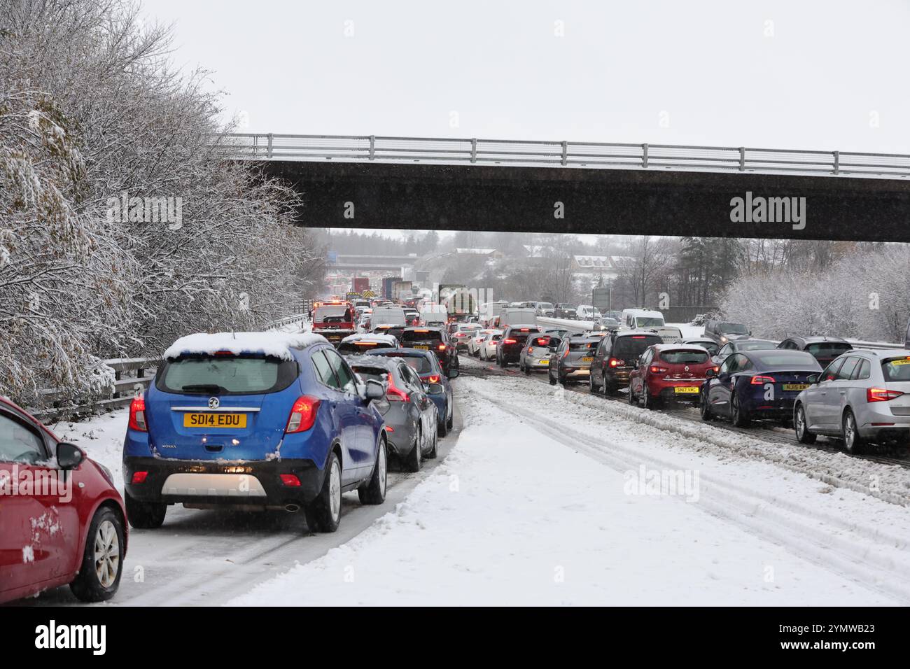 Traffic at a standstill in bad weather conditions on the M80 near ...