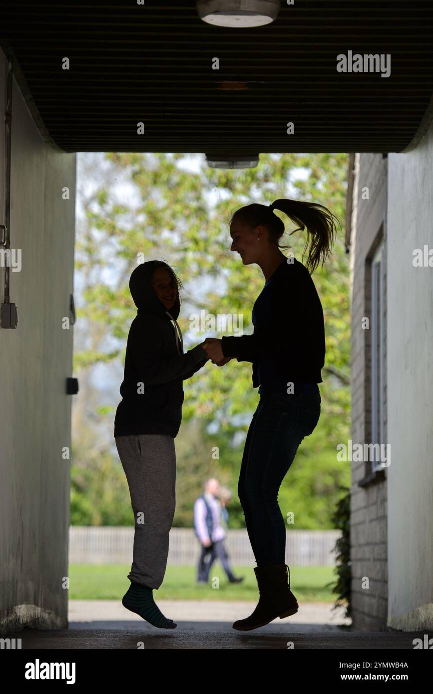 An anonymous child plays with their mentor at a school, UK Stock Photo - Alamy