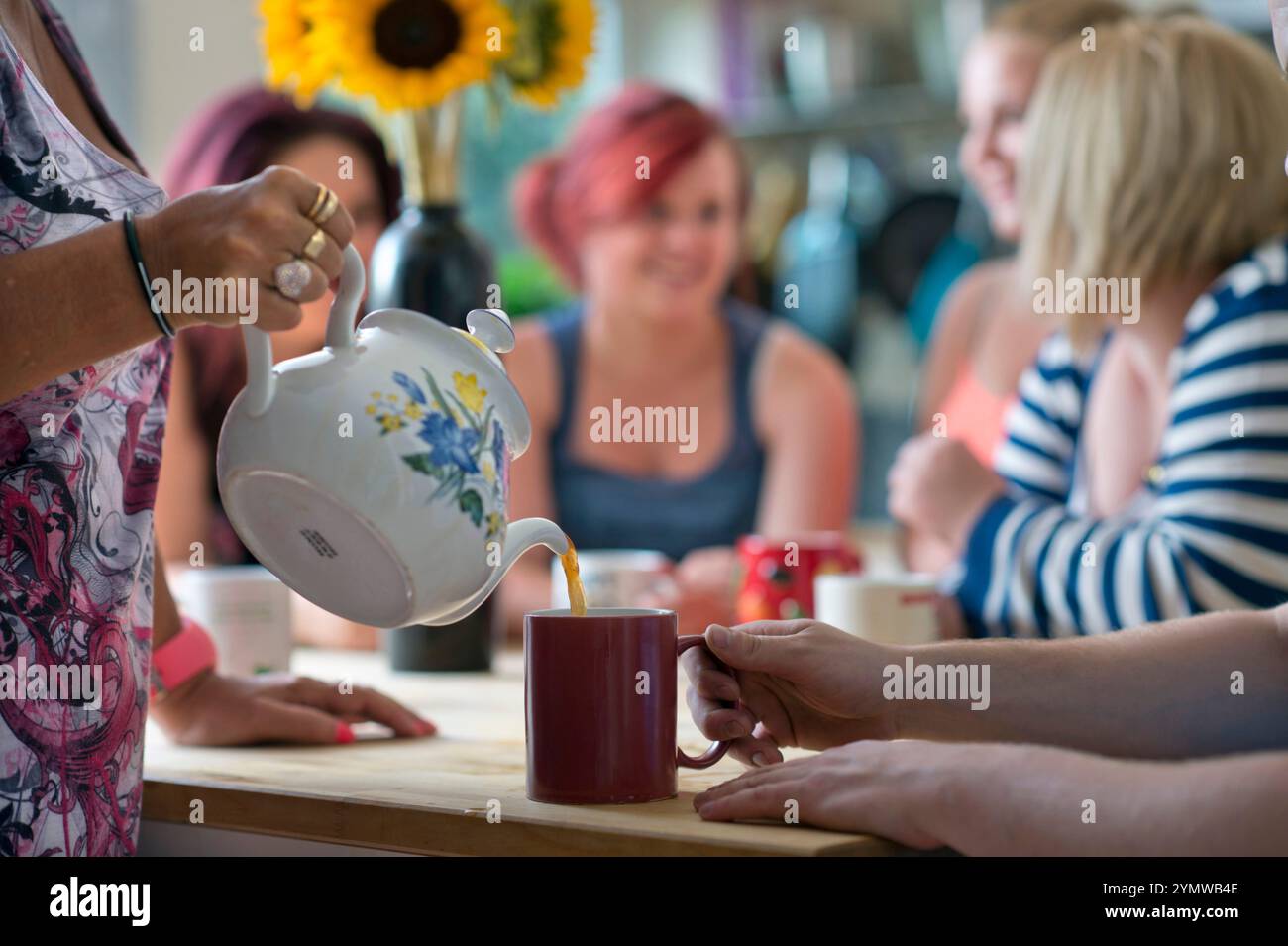 Family taking tea, UK Stock Photo - Alamy