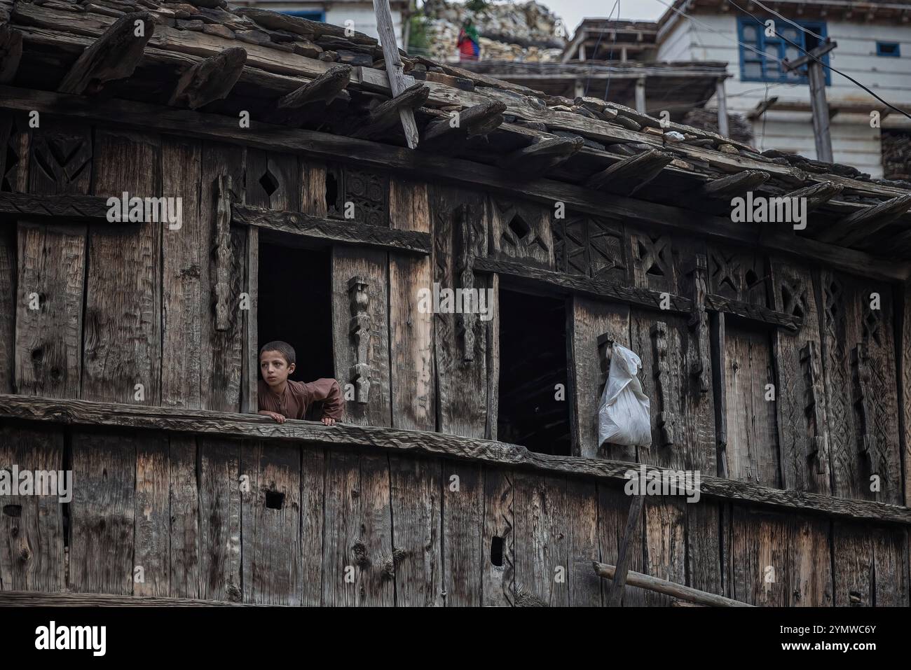 Houses that are over 600 years old, with windows adorned with the ...