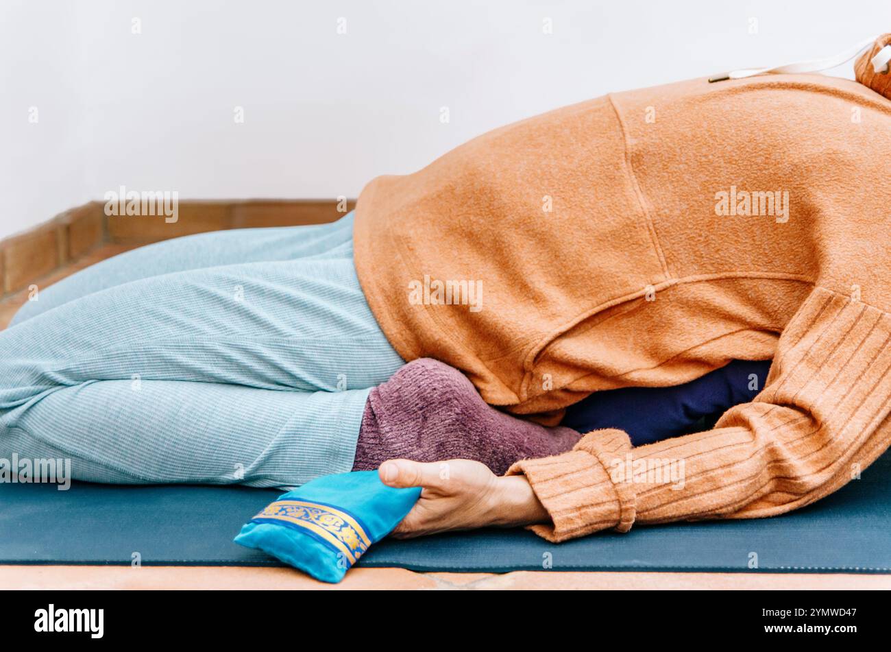Details of woman in relaxing yin yoga pose on outdoor terrace Stock ...