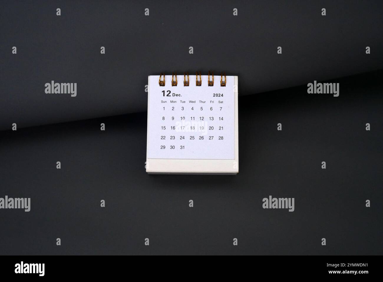 December 2024 desk calendar on the gray background Stock Photo - Alamy