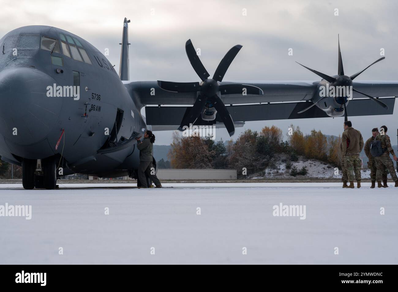 An aircrew assigned to the 37th Airlift Squadron conducts post-flight ...