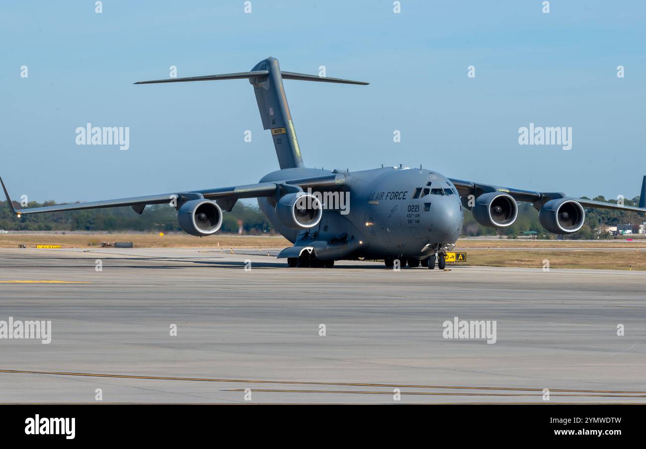 U.S. Air Force pilots from the 16th Airlift Squadron taxi a C-17 Globemaster III cargo aircraft ...