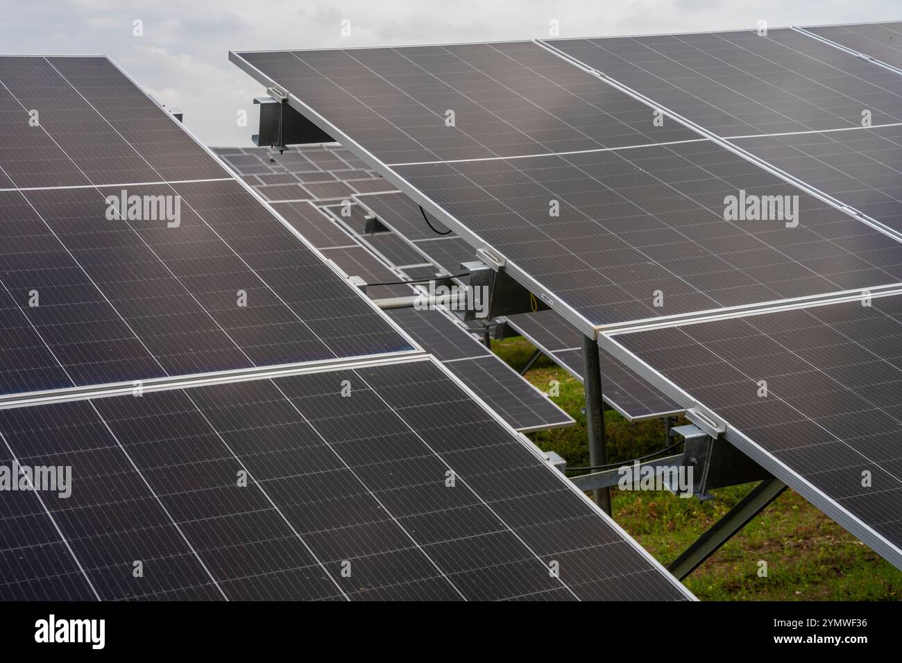 Rows array of photovoltaics solar cells in solar power station. Alternative clean renewable ...