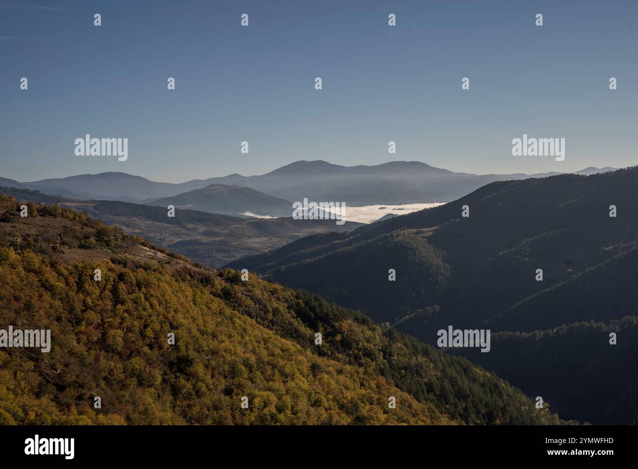 Sunset with tops of Golija mountain on the foggy horizon Stock Photo ...