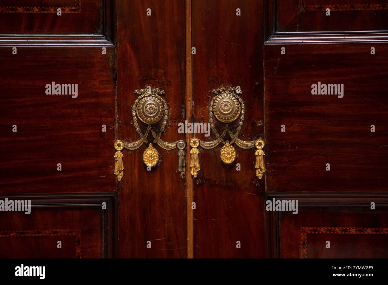 Wooden doors at the end of hall with black and white tails Stock Photo ...