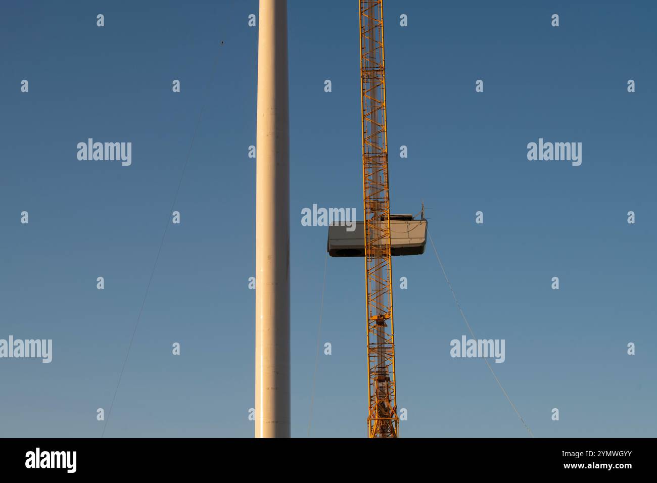 Construction site on windmill farm during day from distance Stock Photo ...