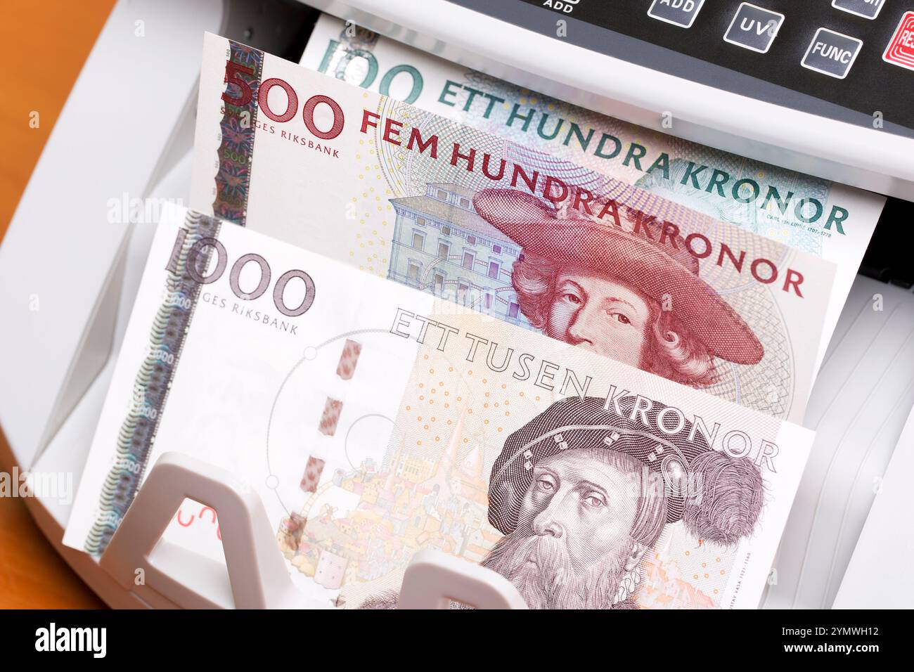 Swedish money - Crown in the counting machine Stock Photo - Alamy