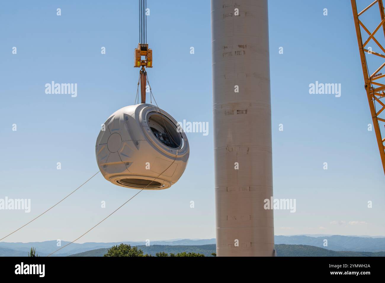 Construction site on windmill farm with heavy machinery during day from ...
