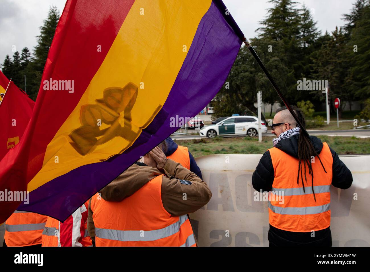 Several people hold Republican flags during the 19th rally in front of ...