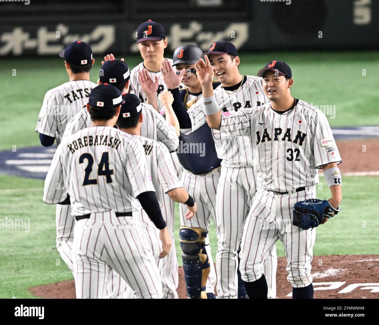 Japan national team players celebrate after winning the baseball ...