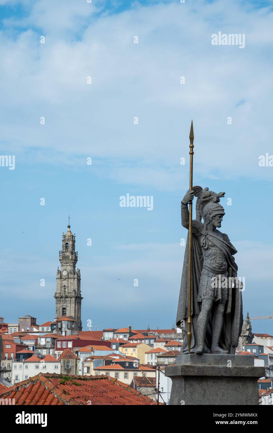statue of a warrior holding a spear, standing atop a pedestal, with a ...