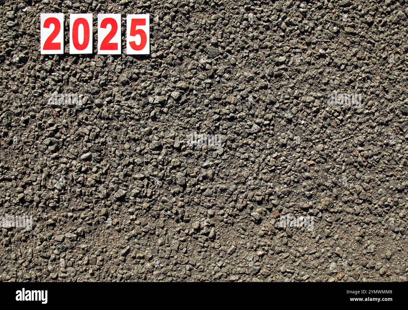Numbers of 2025 year. Paper square numbers on the stone road background ...