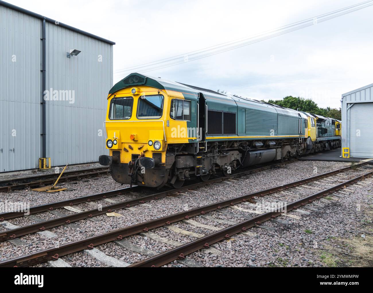 Modern Class 66 and Class 70 freight train locomotives in a railway ...