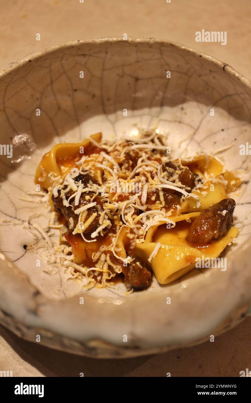 Italian cuisine: strichetti with ragu sauce and ricotta salata (salted ...