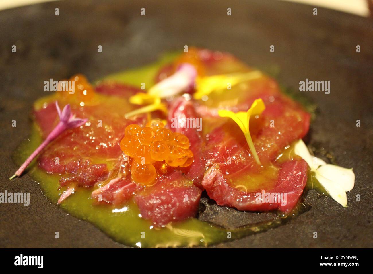 Italian cuisine: aged yellowfin tuna with pistachio sauce Stock Photo ...