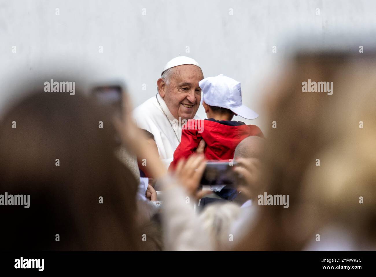 Smiling Pope Francis interacts with child during public event ...