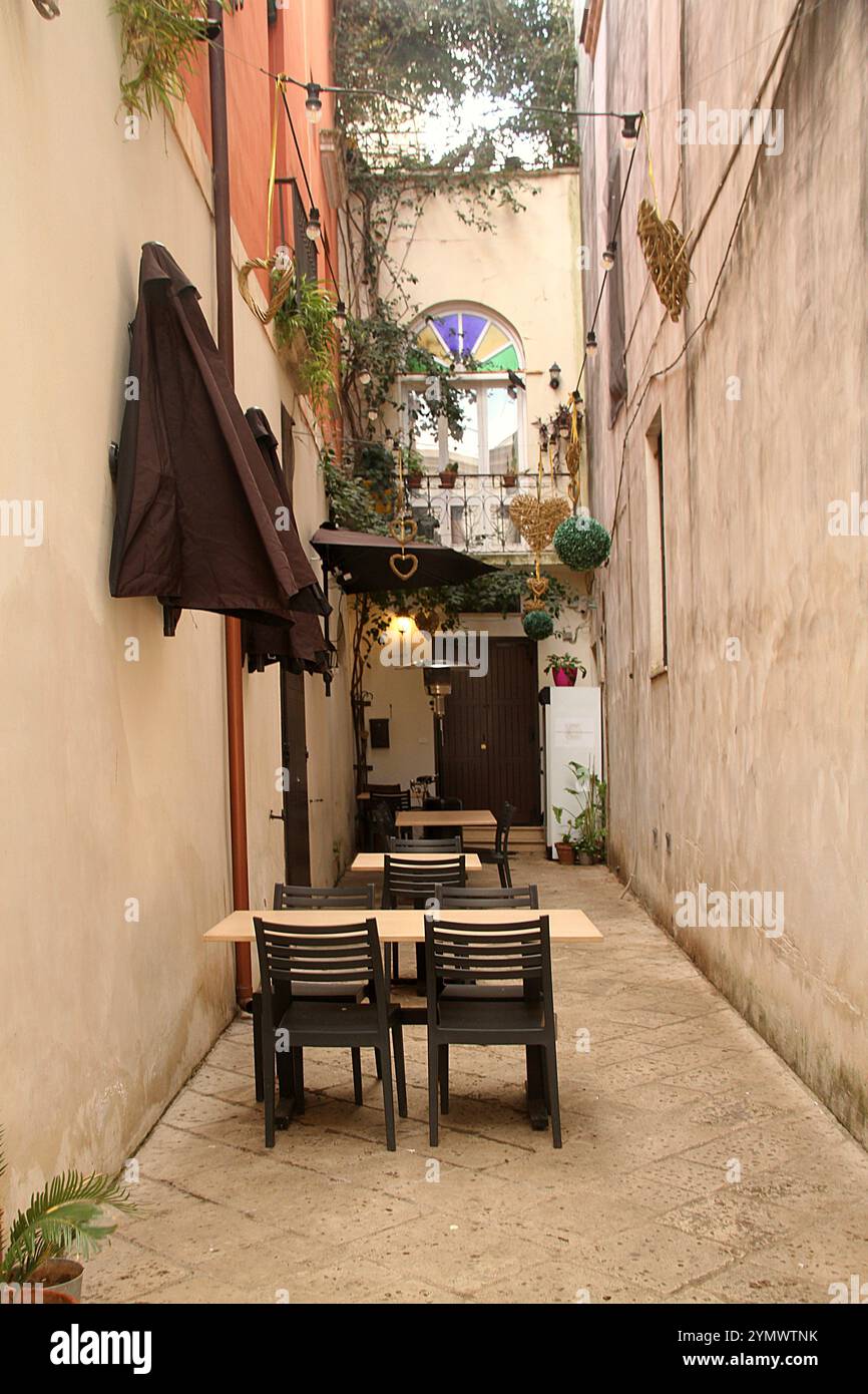 Nardò, Italy. Outdoor seating area of a local restaurant on one of the ...