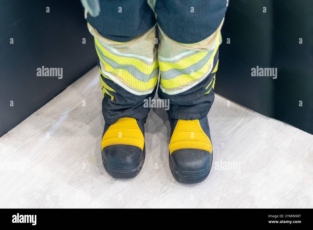 firefighter boots and trousers, protective work clothes Stock Photo - Alamy