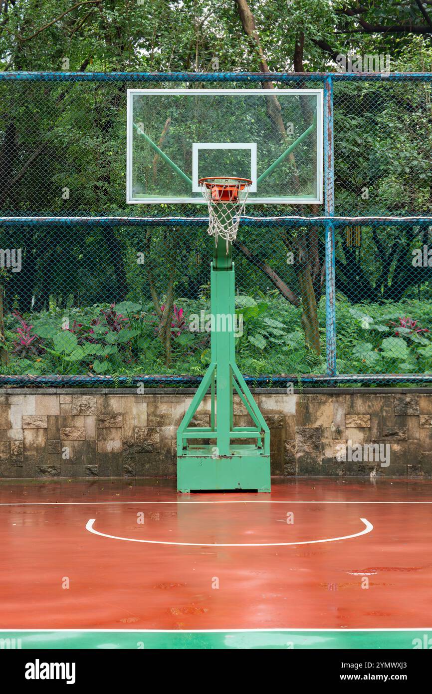 an outdoor basketball court after the rain at vertical composition ...