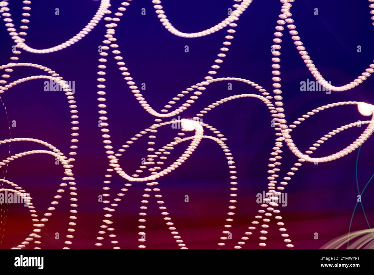 This image features intricate light trails with a beaded effect ...