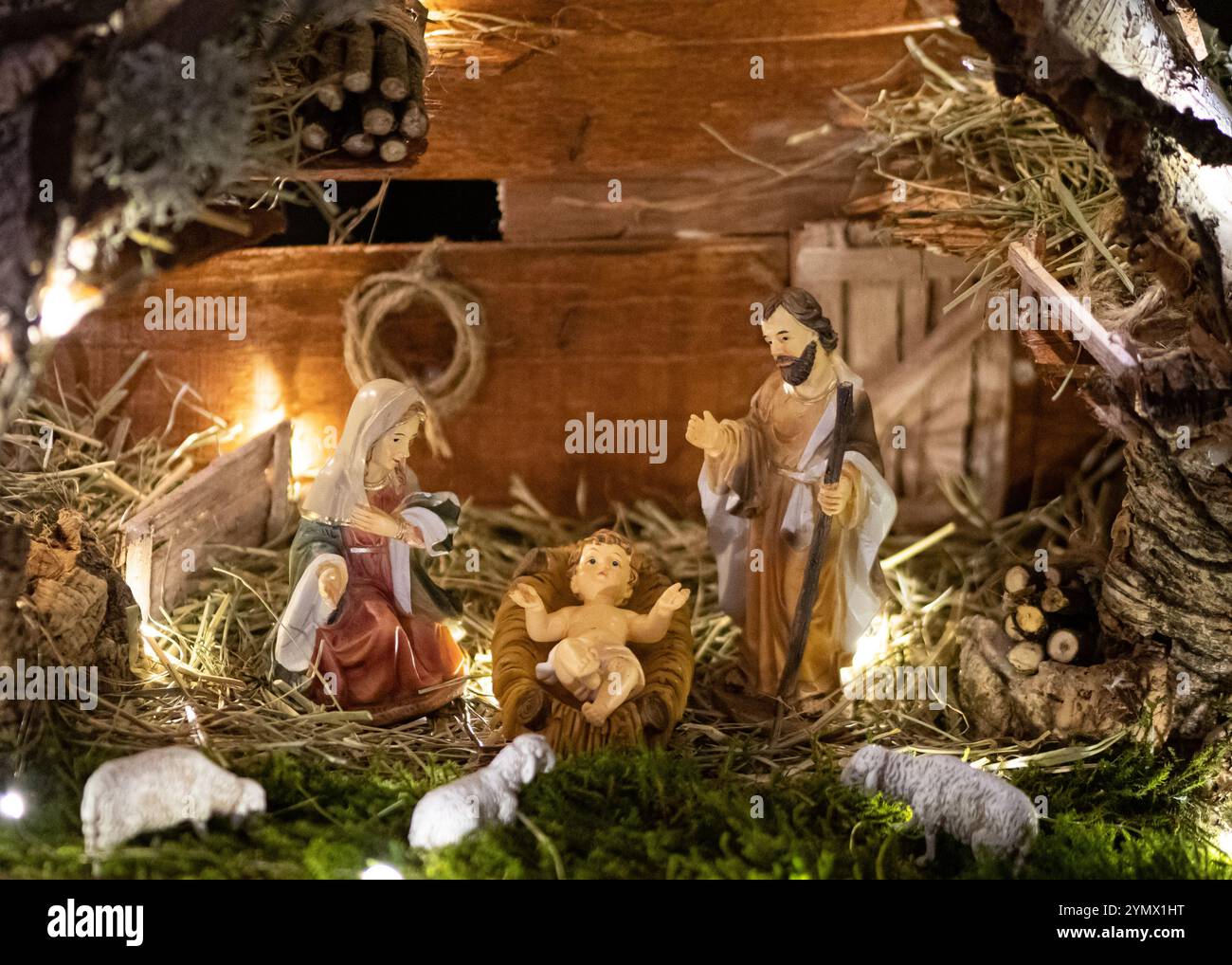 Beautiful Christmas nativity scene with holy family in a handmade wooden old stable, Italian ...