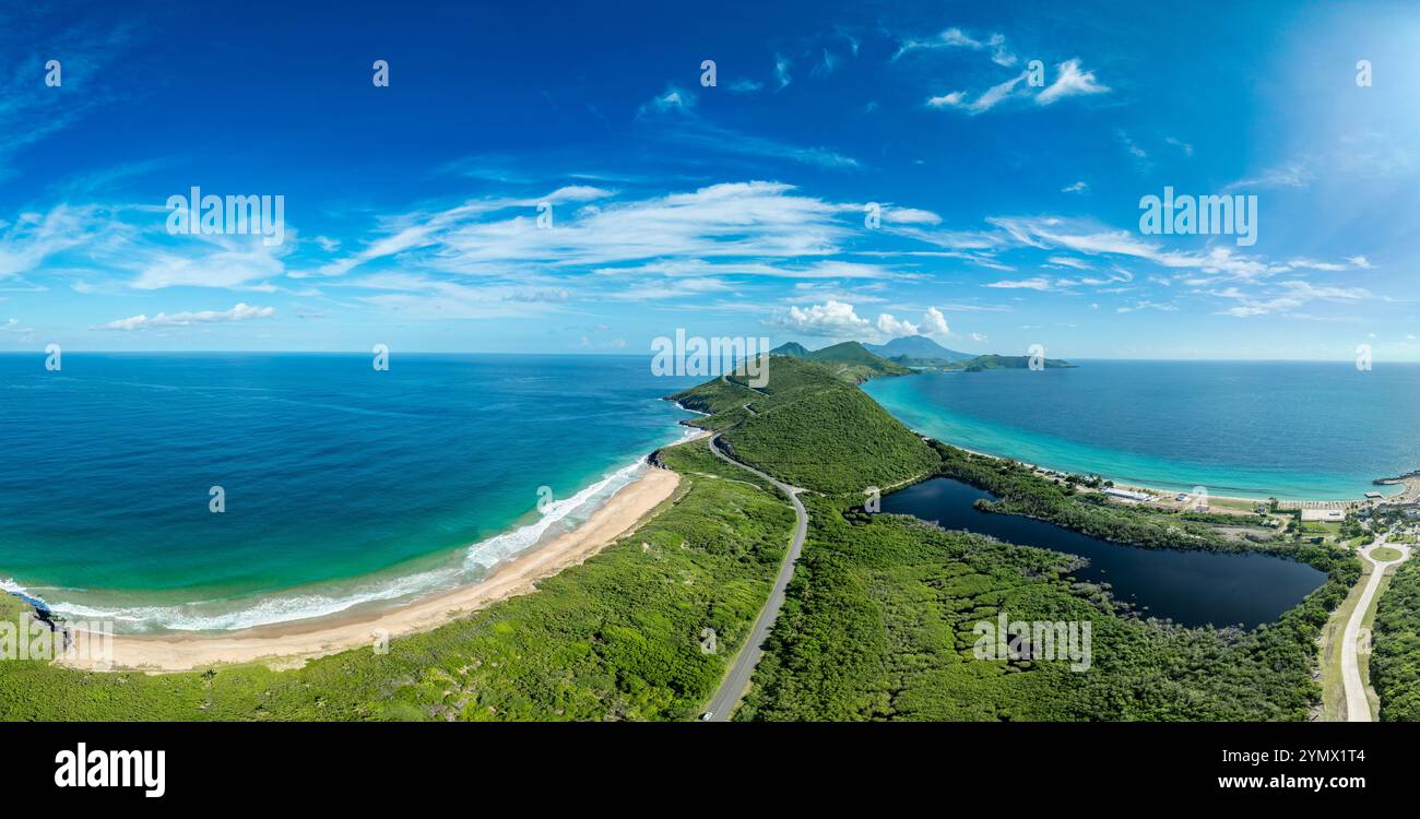 Aerial view of St Kitts shores with turquoise water Nevis peak in the ...