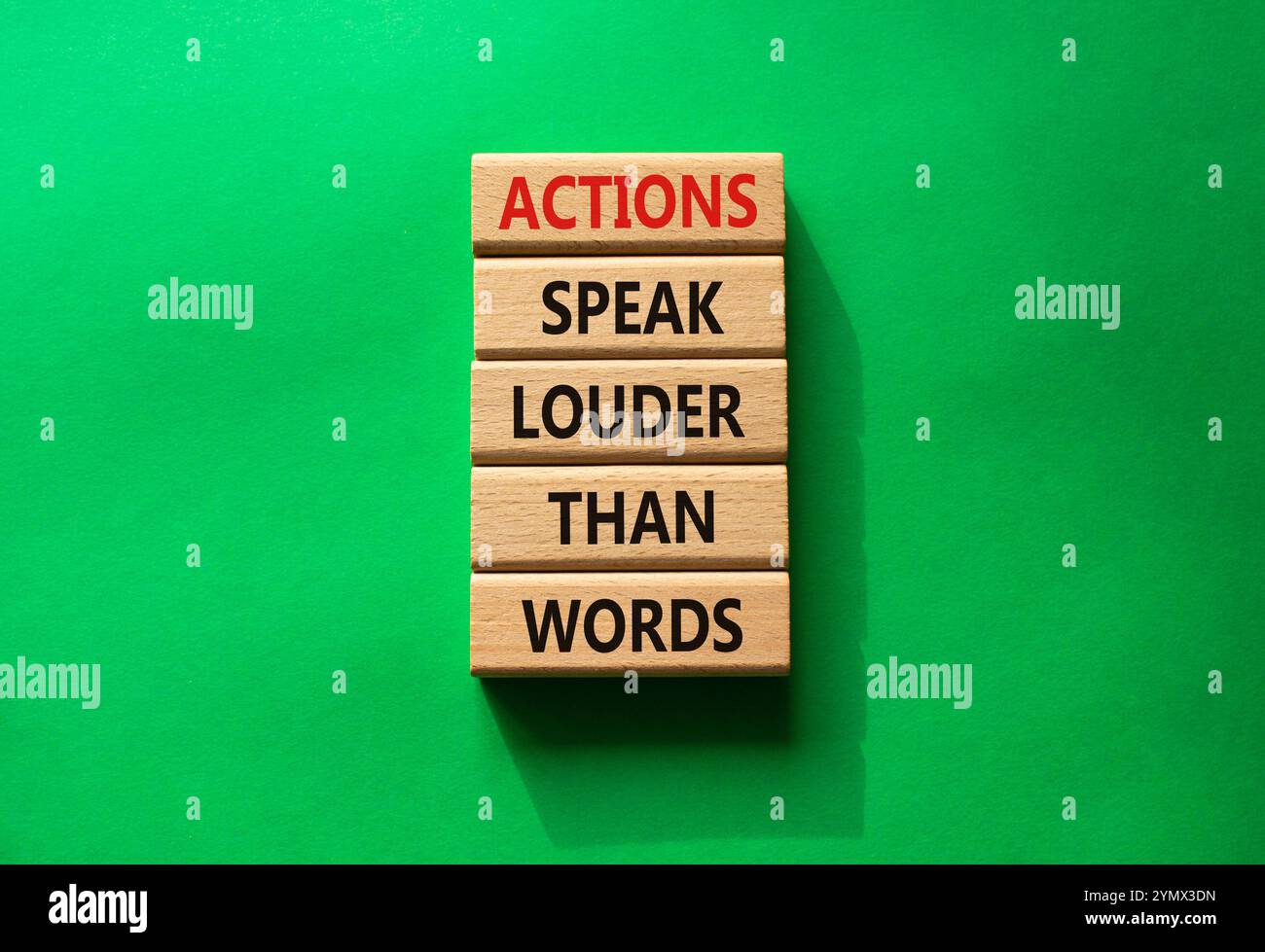 Actions speak louder than Words symbol. Wooden blocks with words ...