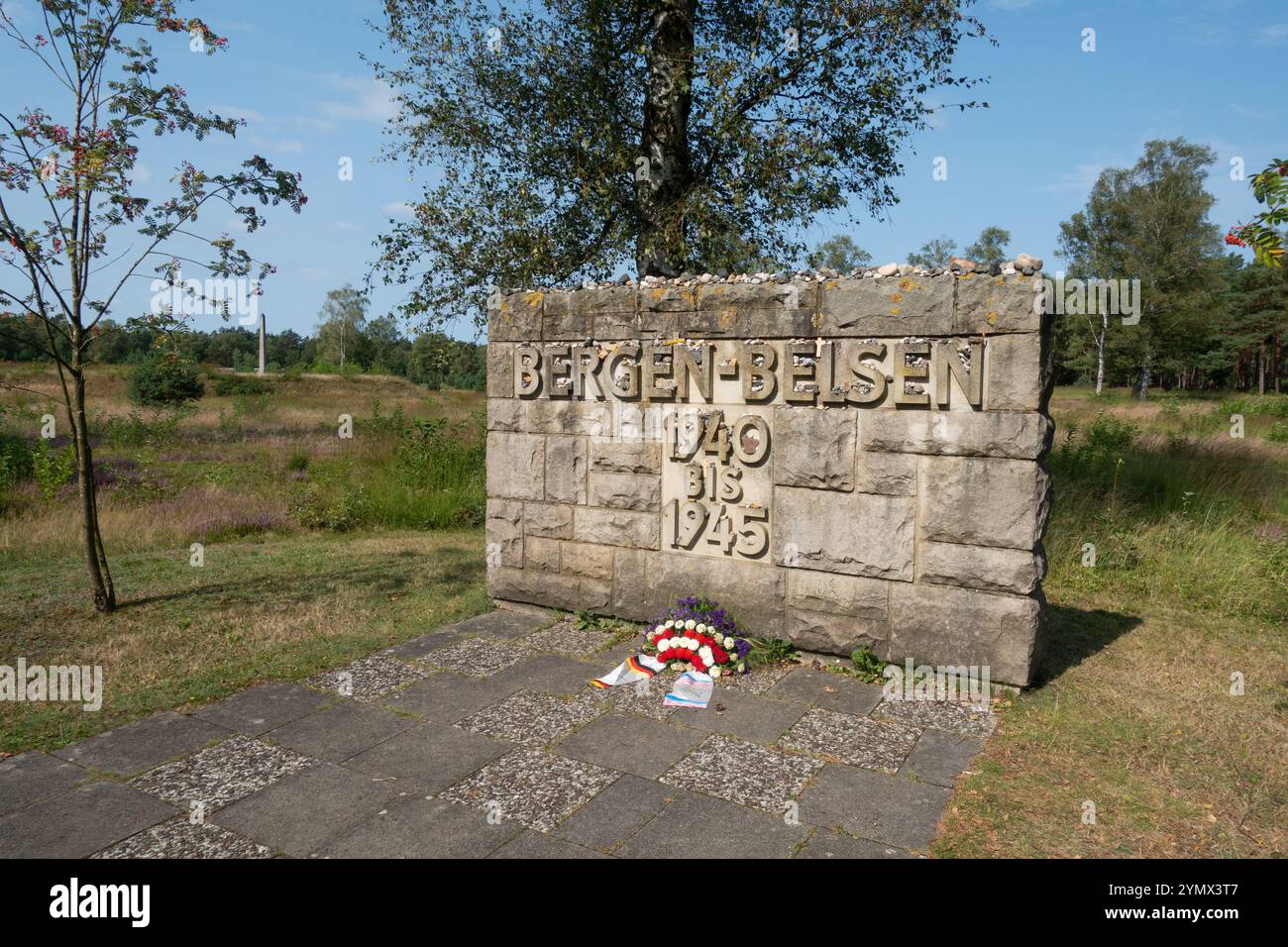 The stone wall at the entrance to the Bergen-Belsen Memorial site ...