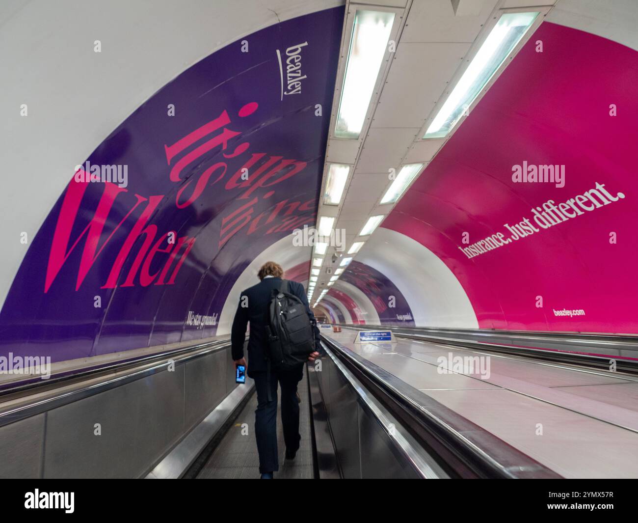 Posters for beazley insurance, on moving walkway, Central London Stock ...