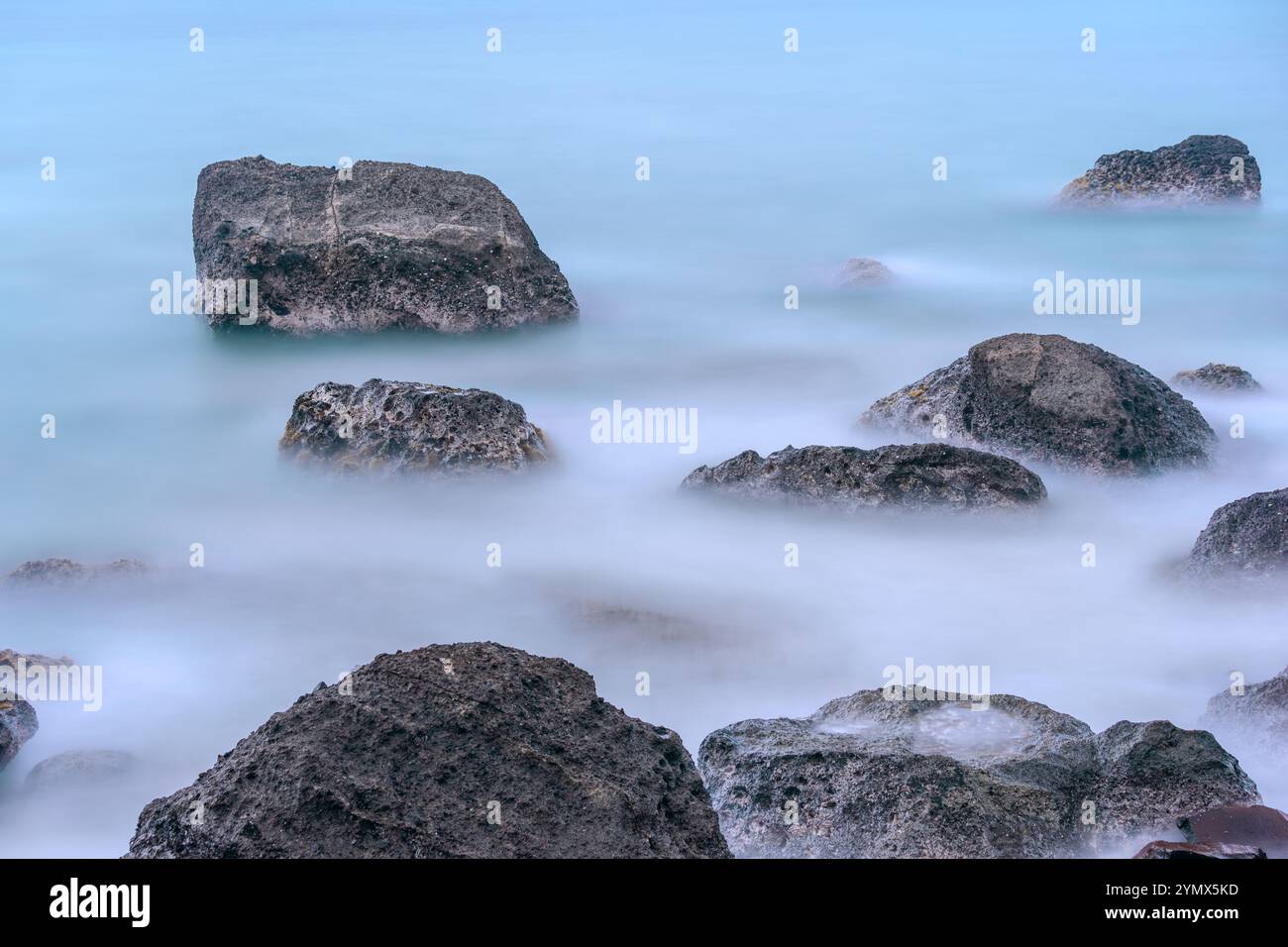 Rocks formation at the beach. Beautiful long exposure rocks in the sea ...