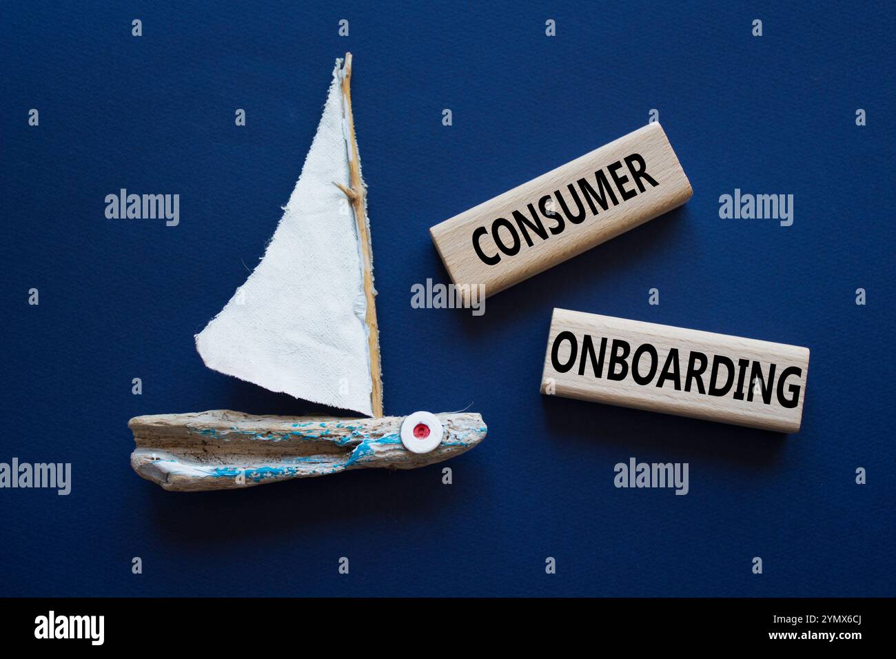 Consumer Onboarding symbol. Wooden blocks with words Consumer ...