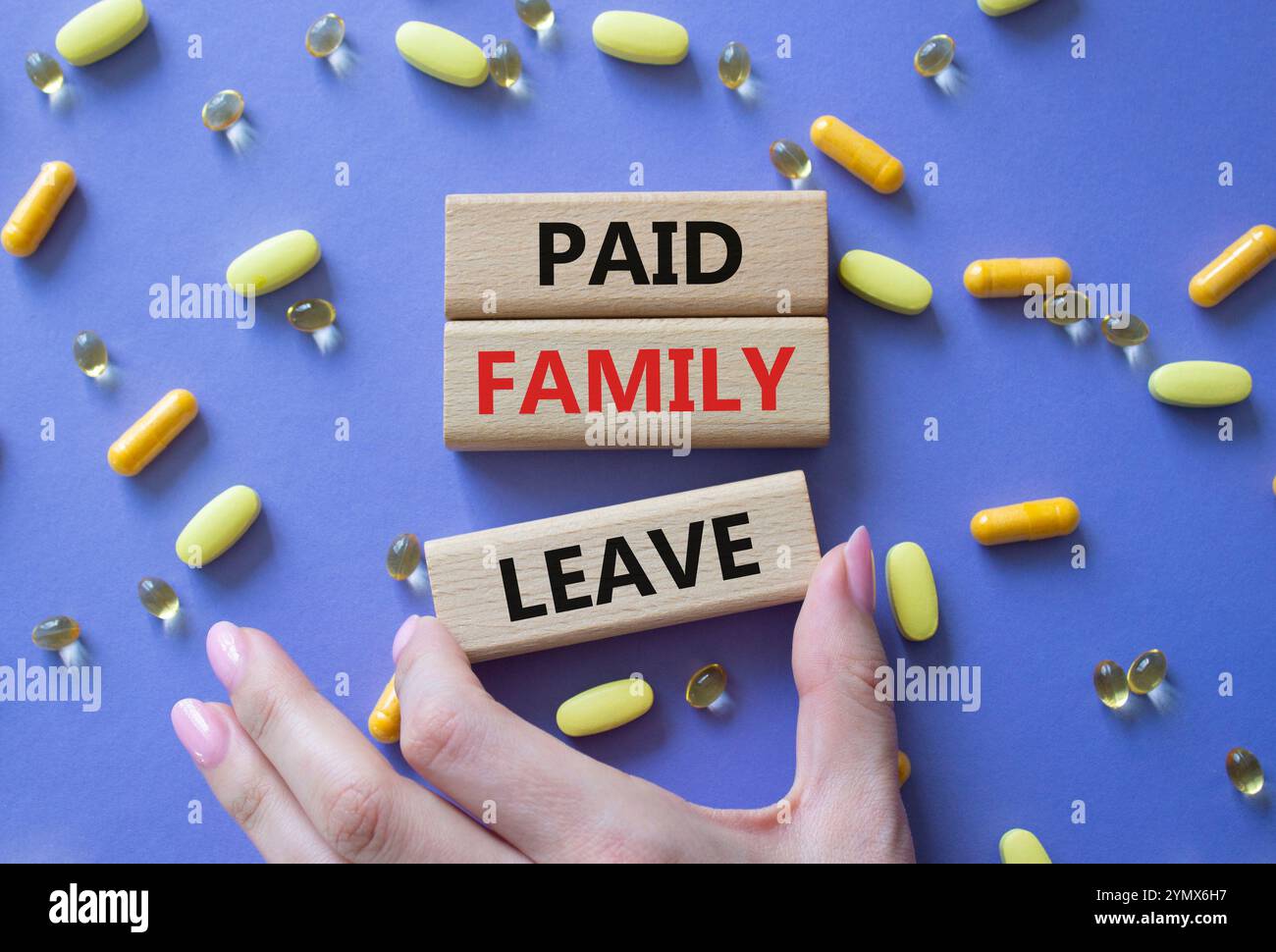 Paid Family Leave symbol. Concept words Paid Family Leave on wooden ...