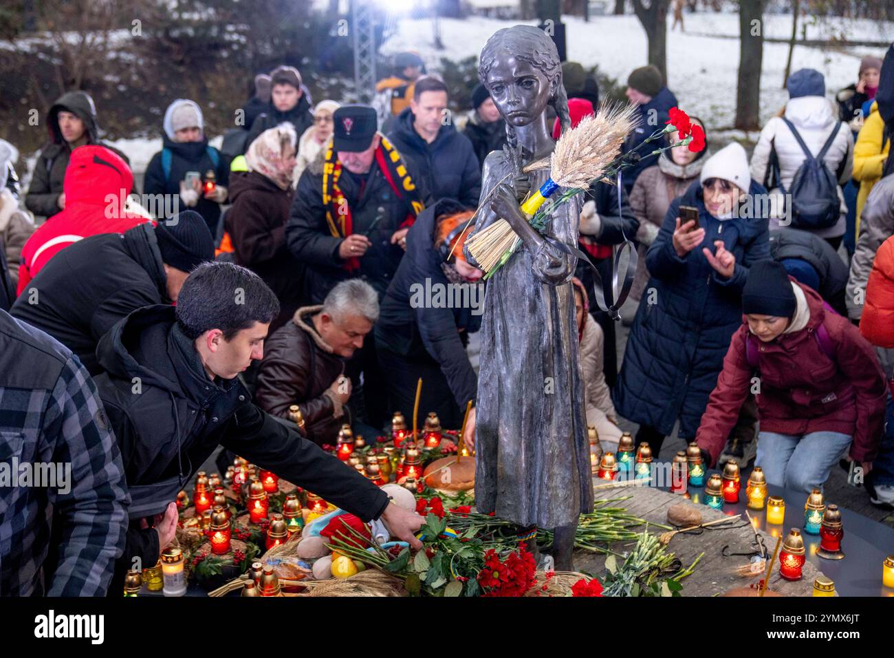 Kyiv, Ukraine. 24th Nov 2024. People seen placing down candles at the ...