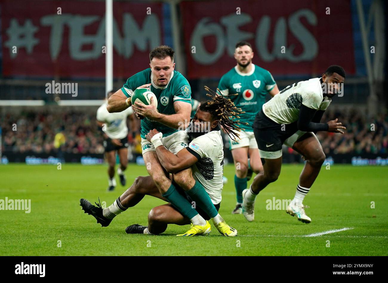 Ireland's Jacob Stockdale tackled by Fiji's Waisea Nayacalevu and Vuate ...
