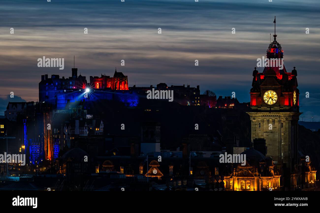 View over city centre at night with Balmoral clock tower and Edinburgh ...