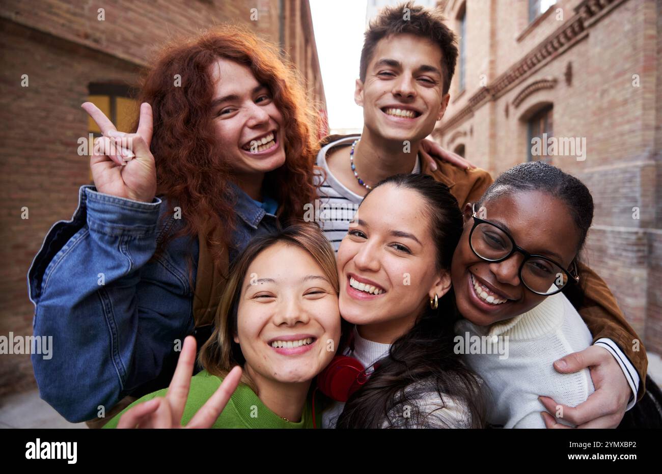 Cheerful group of multiethnic student friends taking a selfie together ...