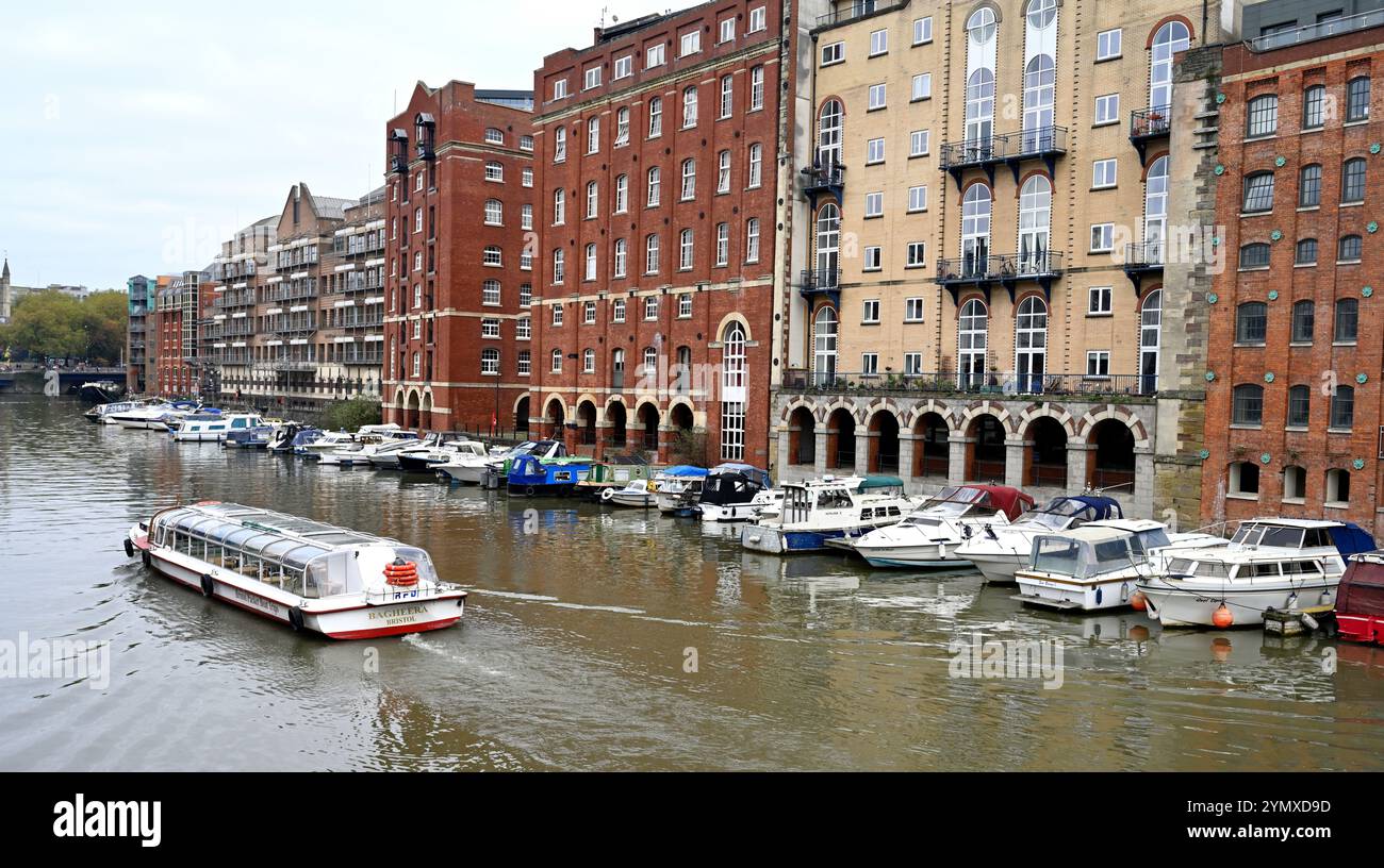 Bristol harbourside with boats moored along Redcliff Quay with ...