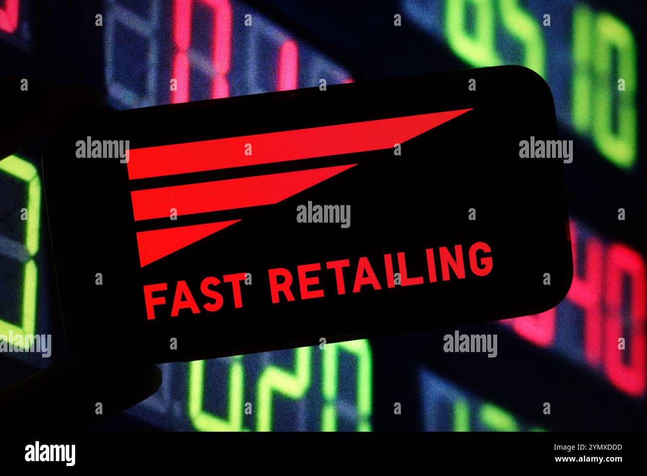 In this photo illustration, the Fast Retailing company logo is seen ...