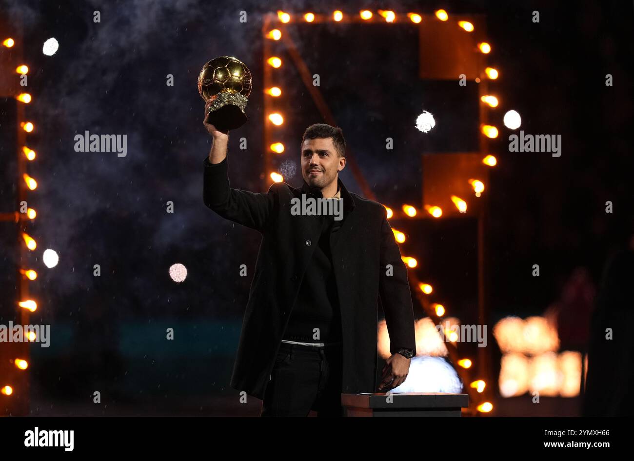 Manchester City's Rodri poses with the Ballon d'Or trophy before the ...