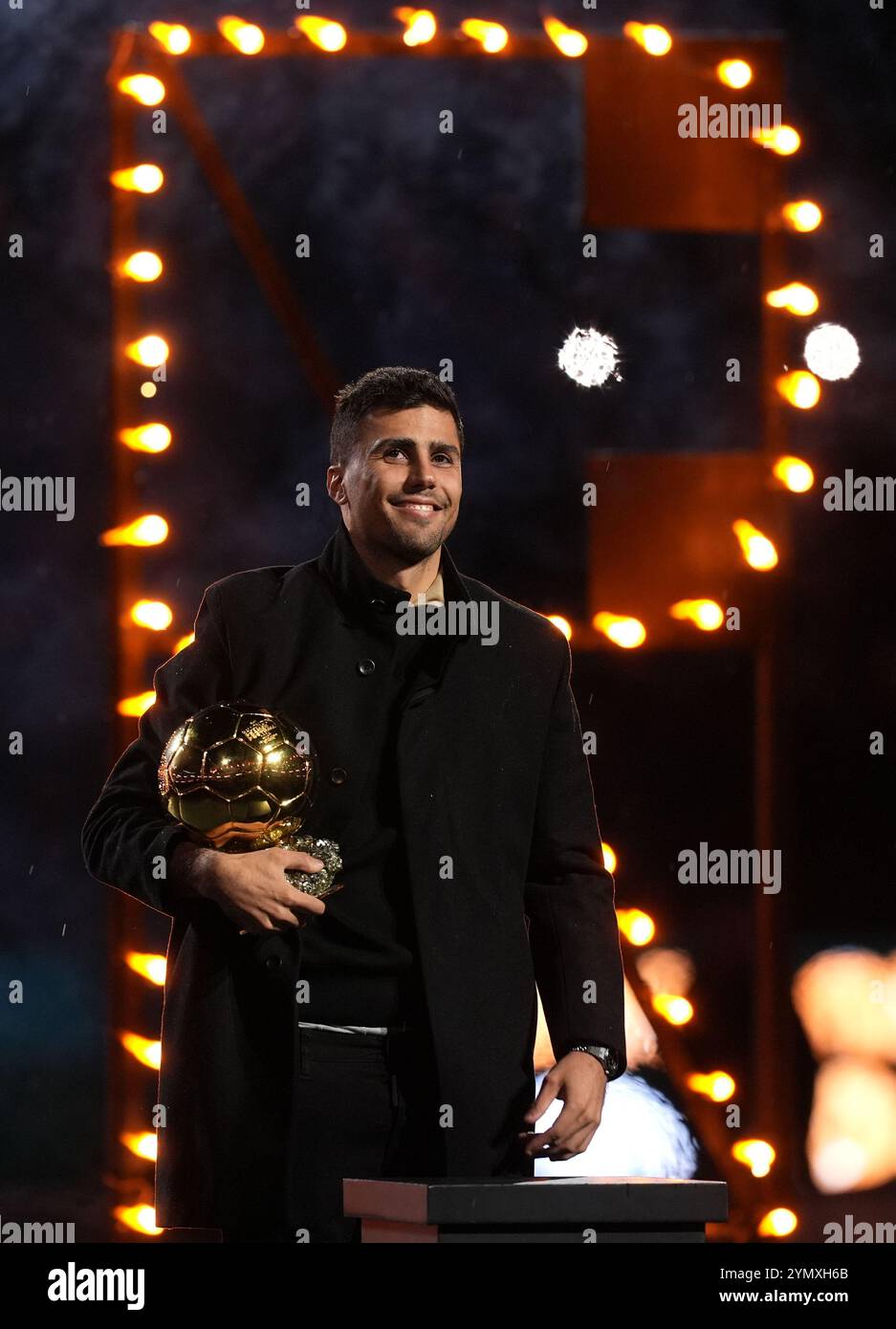 Manchester City's Rodri poses with the Ballon d'Or trophy before the ...