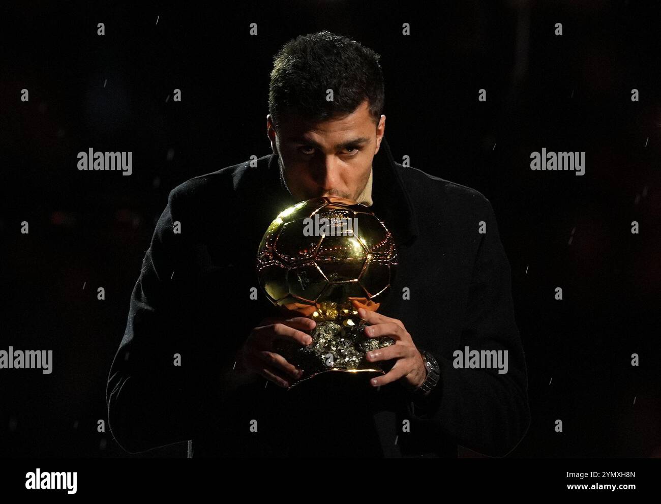 Manchester City's Rodri poses with the Ballon d'Or trophy before the ...